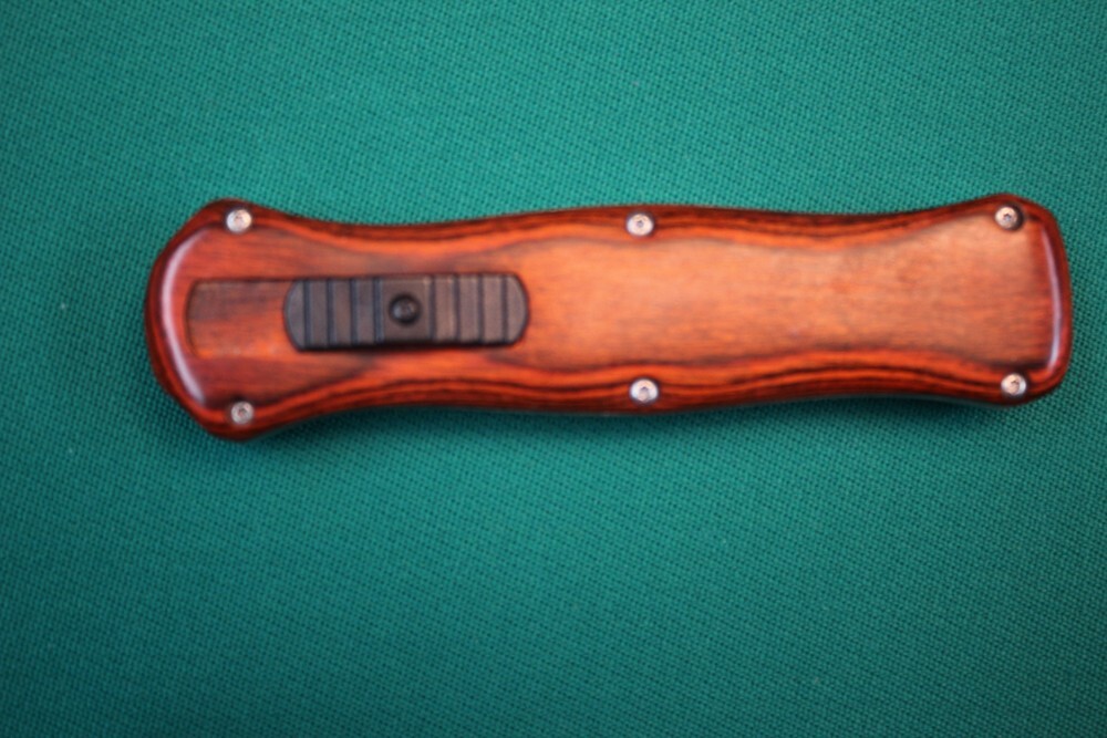 Beautifully crafted OTF with wood handles