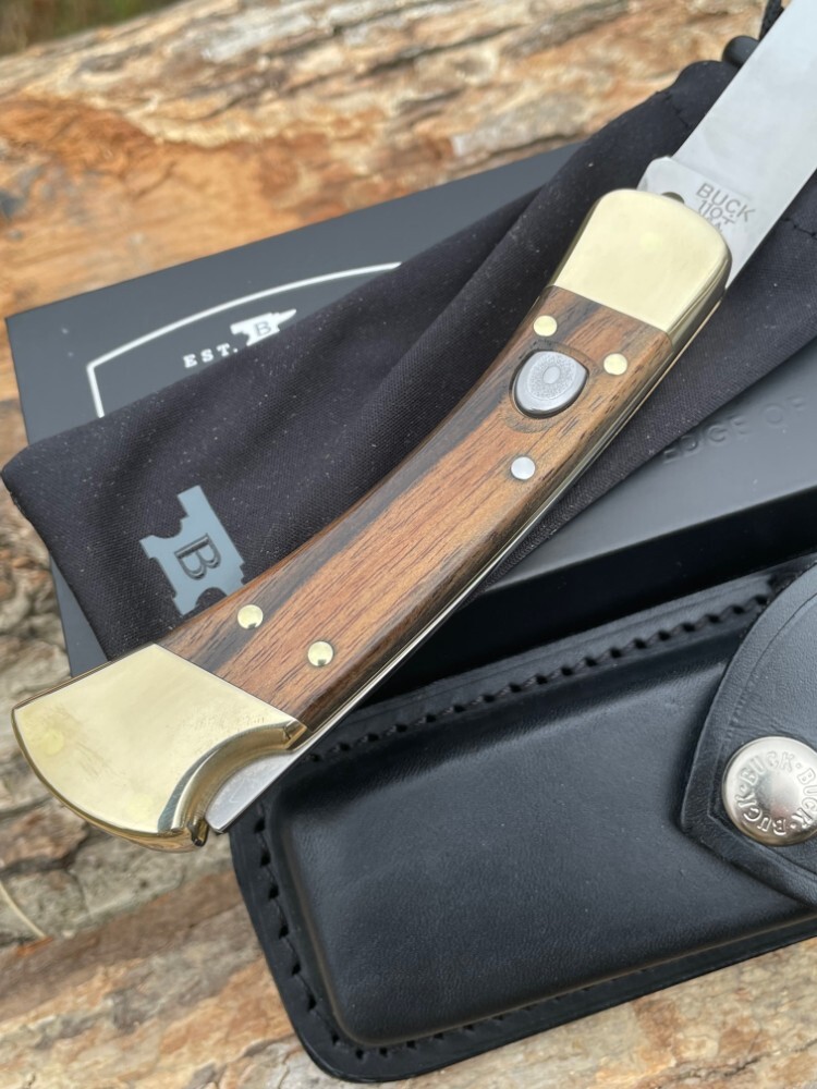 BUCK 110 AUTO BRASS BOLSTER WITH SHEATH & BOX