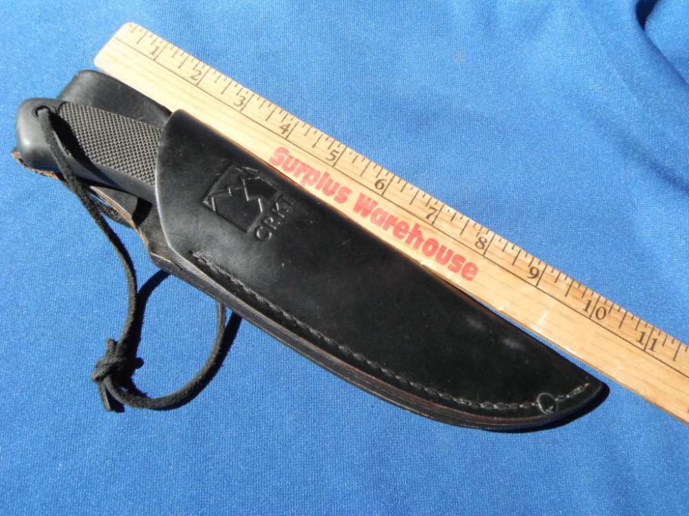 CRKT Wind River 2001 Fixed Blade Knife w/gut hook and leather sheath.