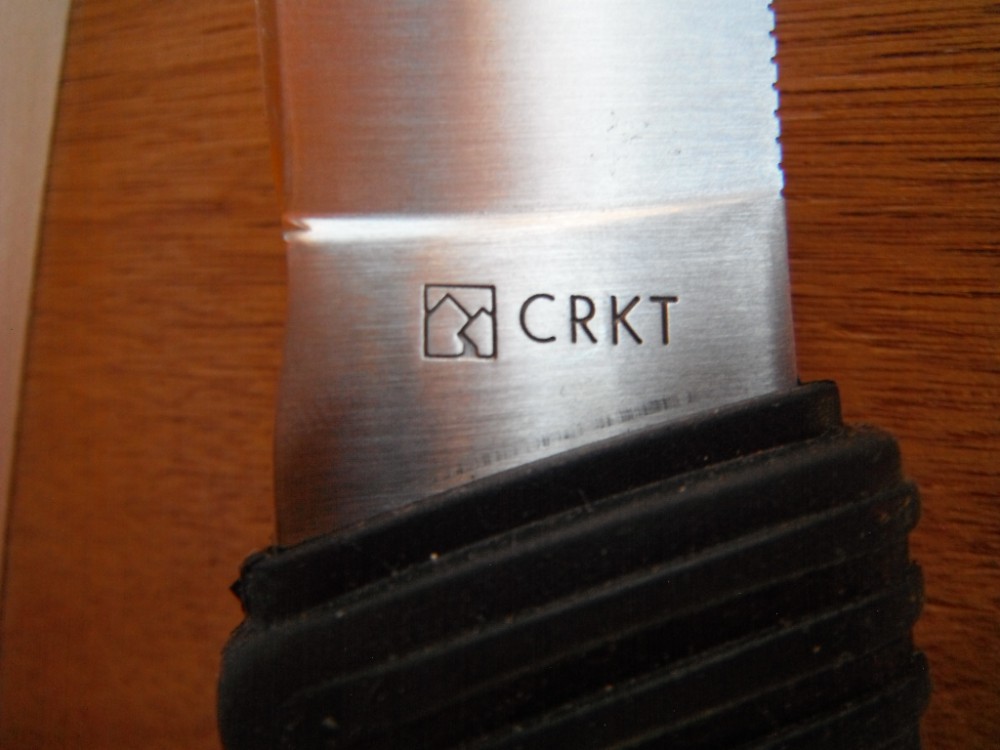 CRKT Wind River 2001 Fixed Blade Knife w/gut hook and leather sheath.