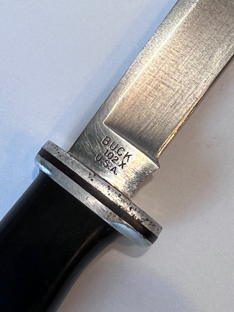 Buck 102 with Sheath. 3 Line Stamp. Light handling and use.