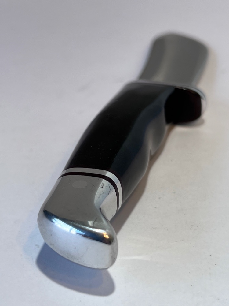 Buck 103, as new, no sheath. 4 brown micarta spacers, 1973-1979. Comes ...