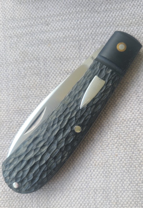 Tim Robertson Full Size Zulu...jigged paper micarta scales.. fluted ...