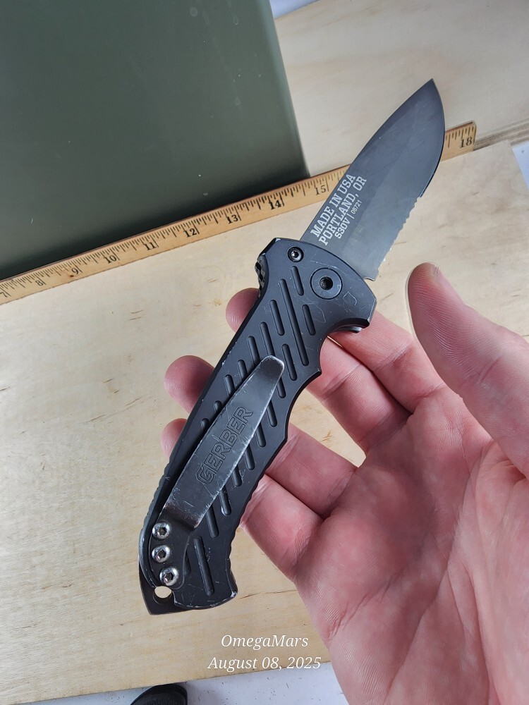 Gerber 06 Auto Drop point Serrated #1A Light usage